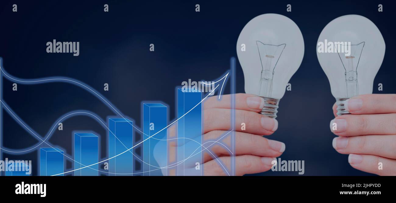 Hands Of Businesswoman Holding Light Bulbs By Digitally Generated Bar ...