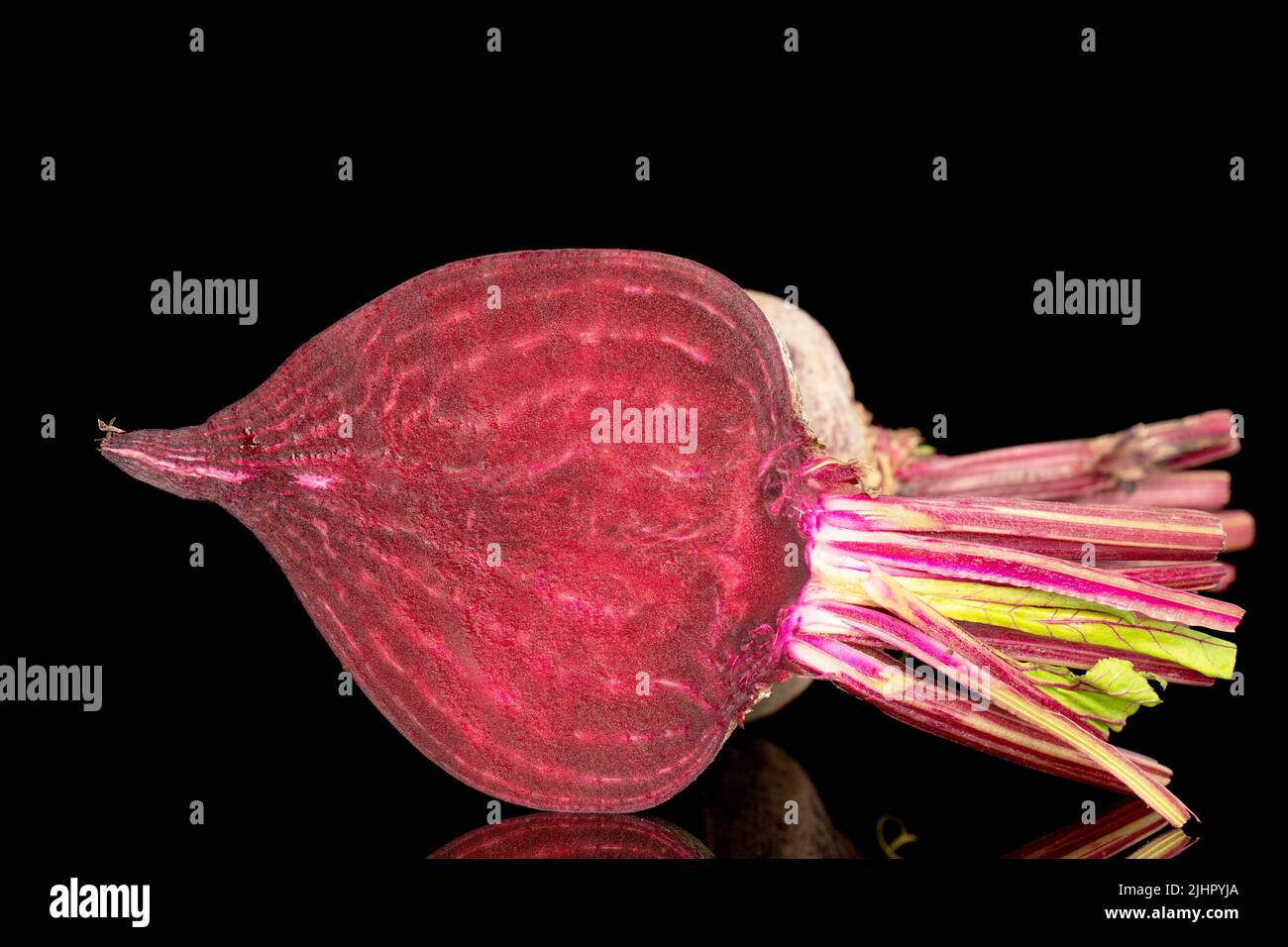 One half of a red beet, close-up, isolated on a black background Stock ...