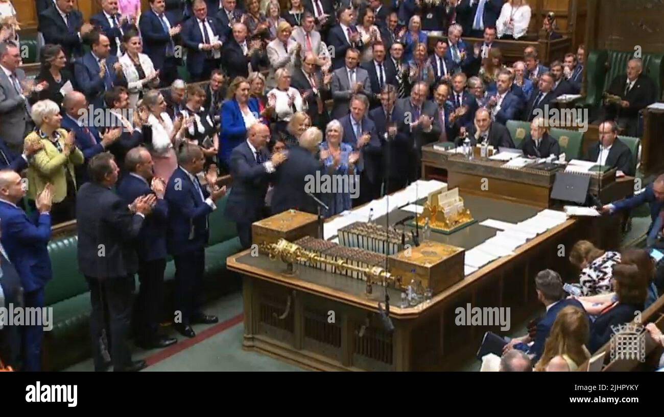 Prime Minister Boris Johnson receives a standing ovation as he leaves ...