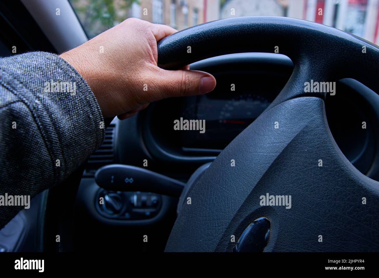 Mans hand steering wheel hi-res stock photography and images - Alamy