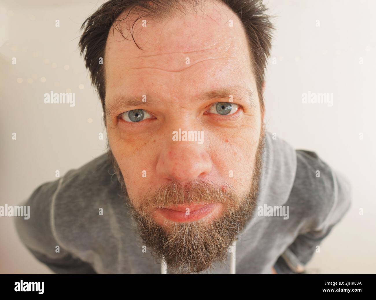 bearded sweaty man after hard work look at the camera Stock Photo - Alamy