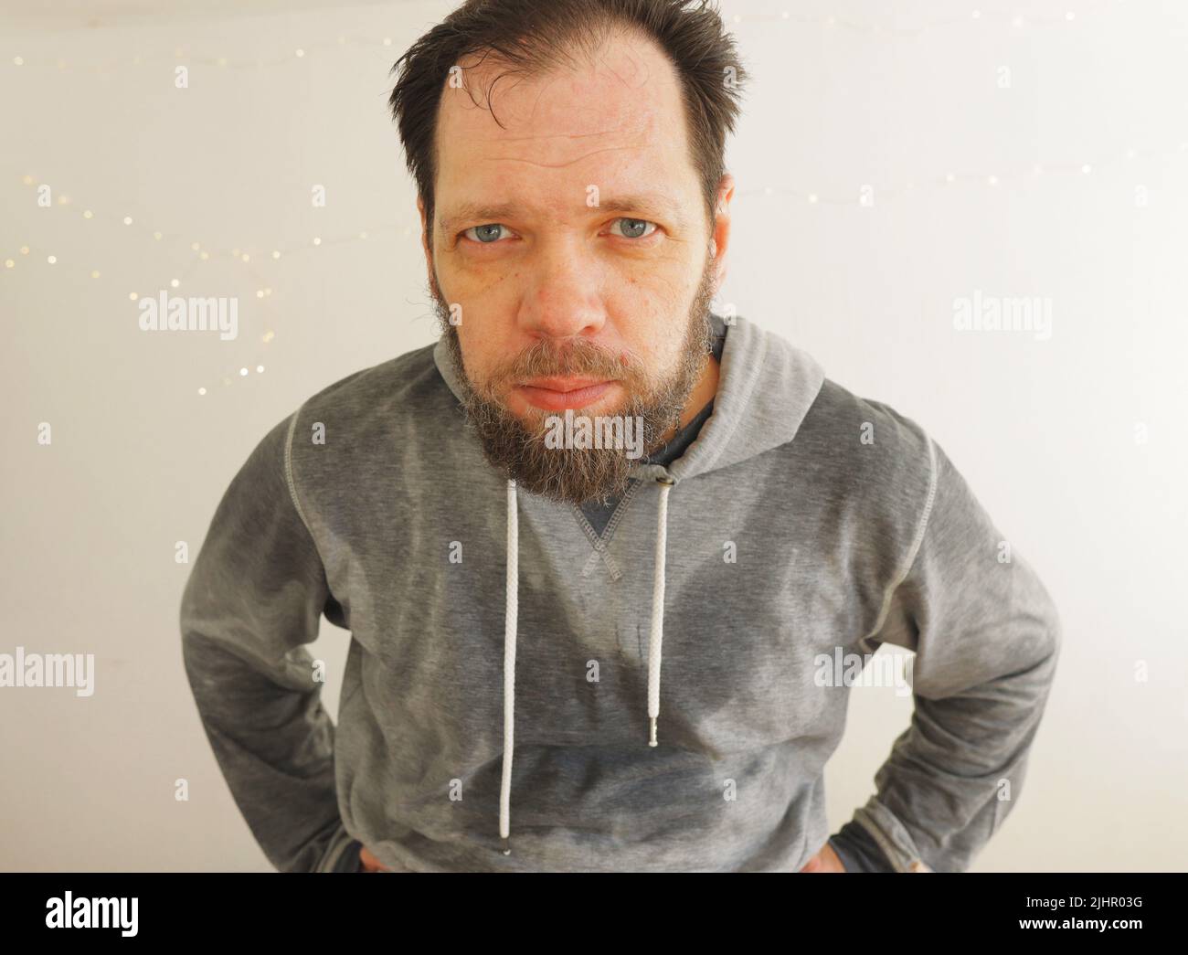 bearded sweaty man after hard work look at the camera Stock Photo - Alamy
