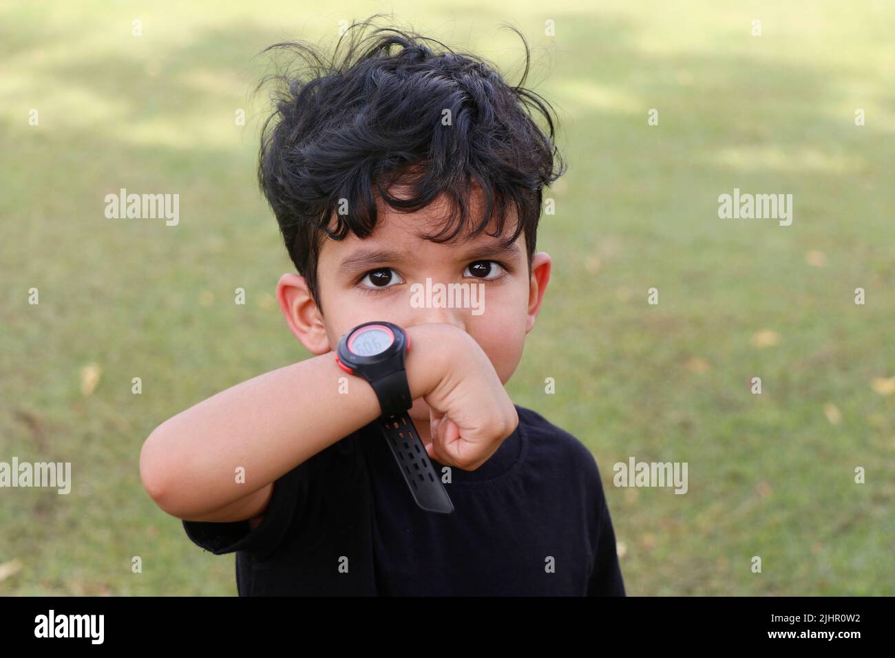 cute baby boy posing with his wrist watch Stock Photo - Alamy