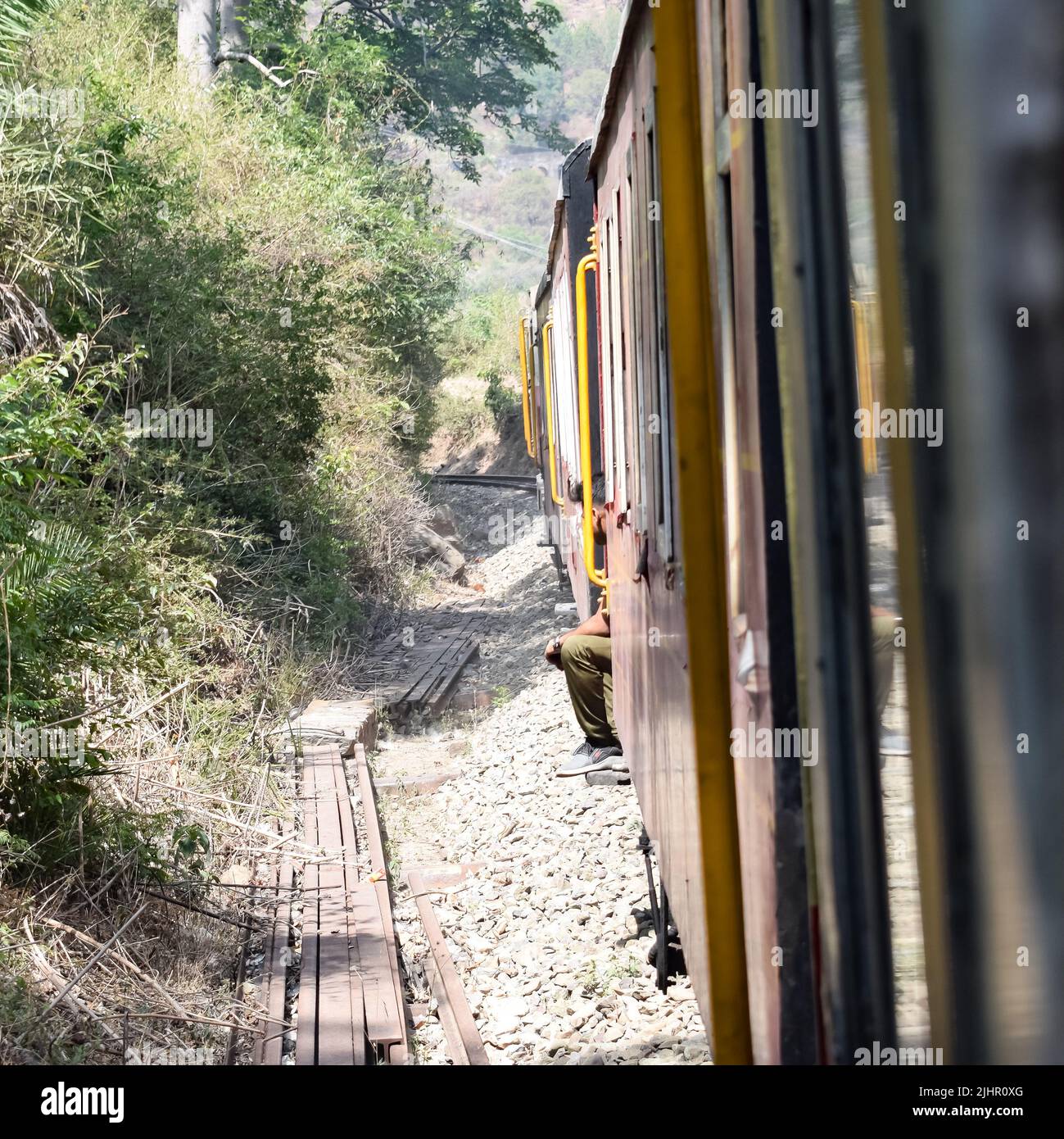 Toy Train moving on mountain slopes, beautiful view, one side mountain ...