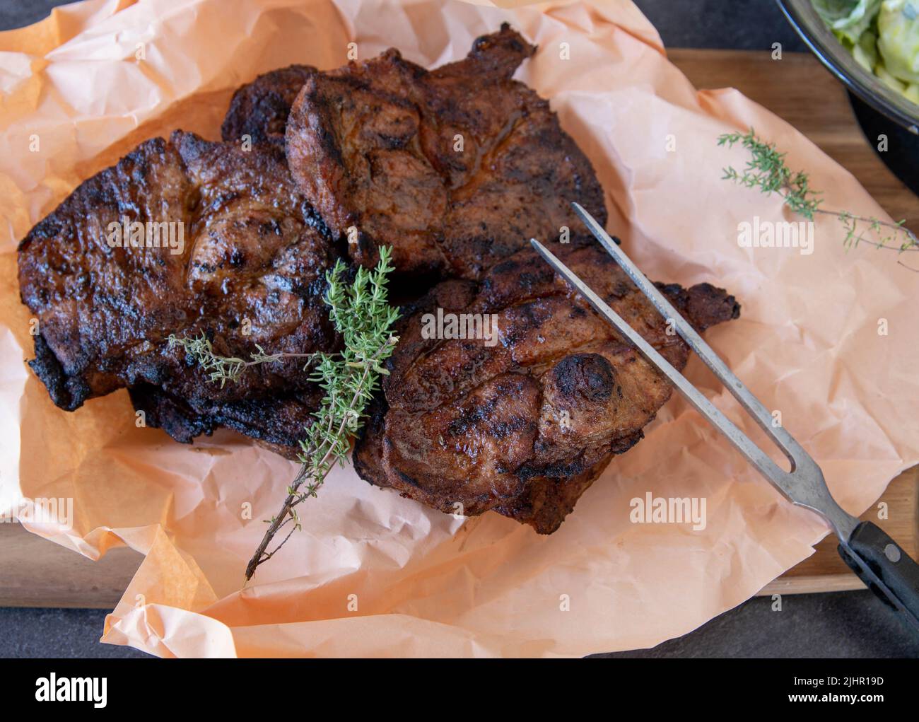 Fresh grilled pork steaks on butcher paper Stock Photo - Alamy