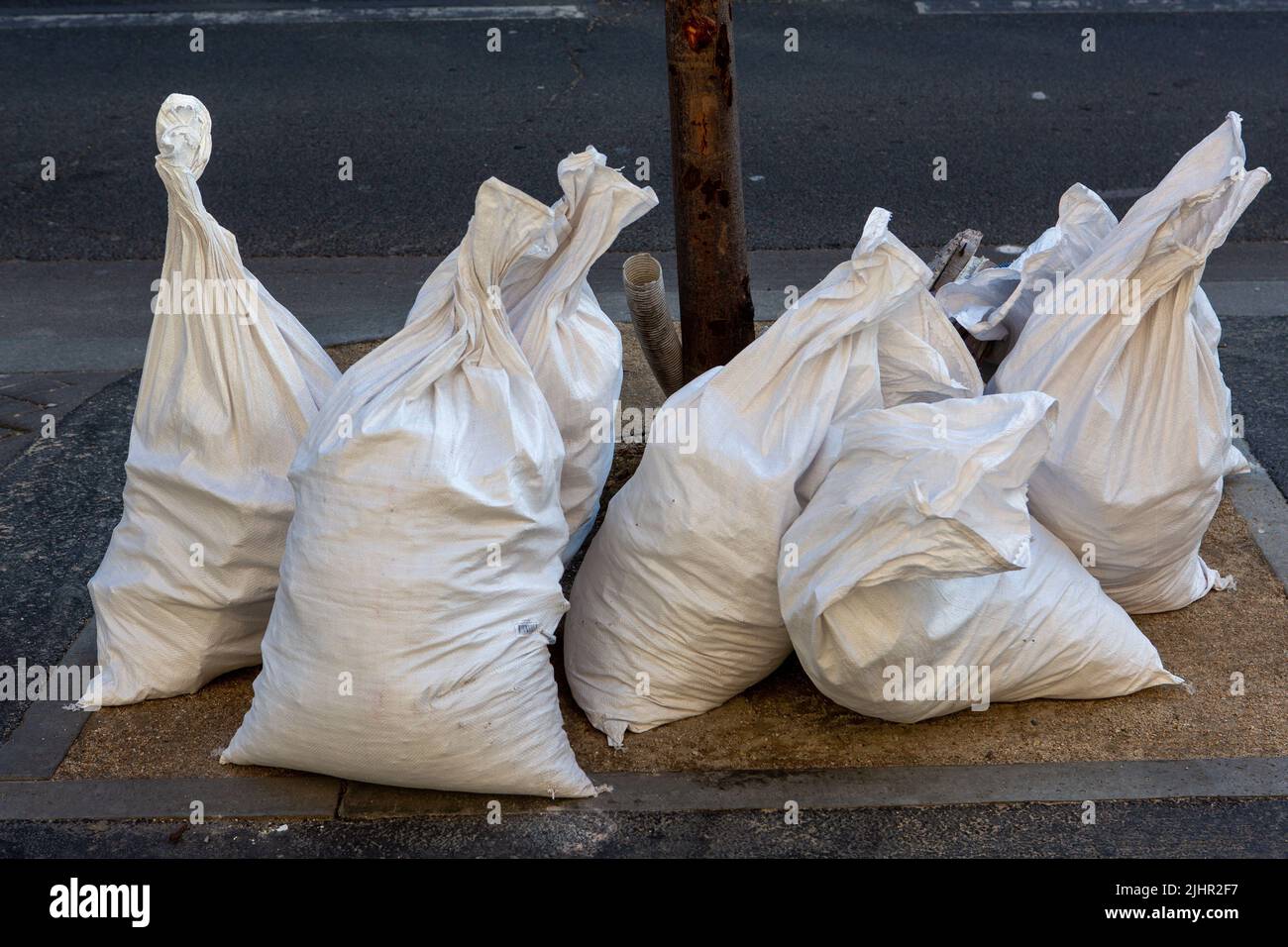 Piled garbage bags on street hi-res stock photography and images - Alamy