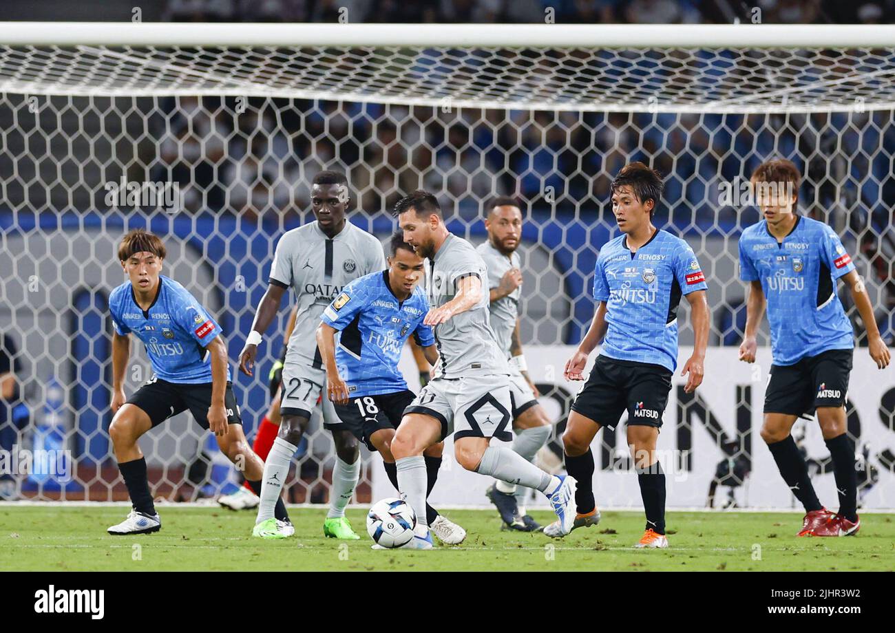 Paris Saint-Germain's Lionel Messi (C) controls the ball during the ...