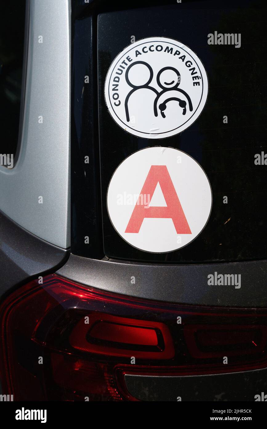 Supervised driving and new driver stickers Stock Photo - Alamy