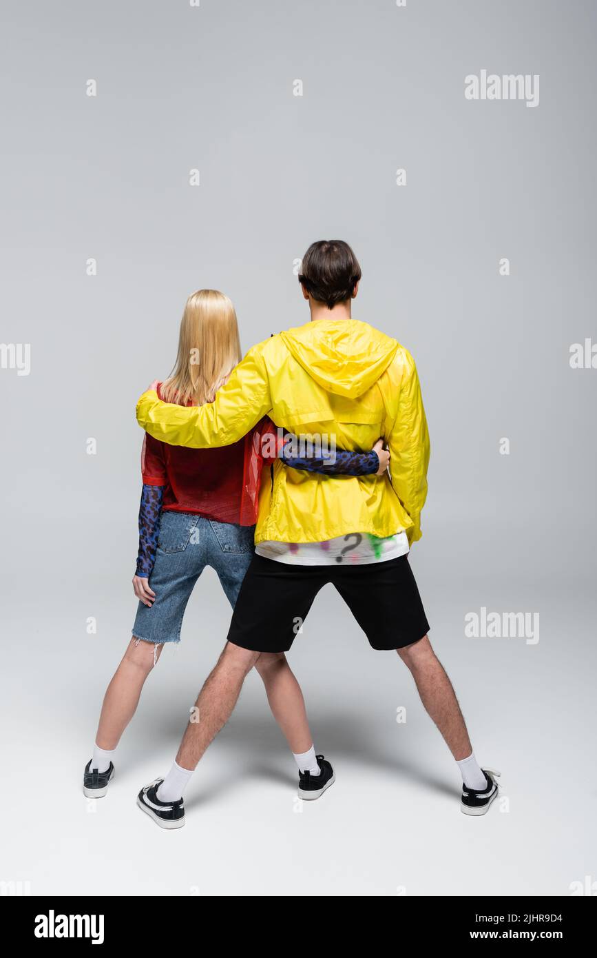 Man hugging back young brunette hi-res stock photography and images - Alamy