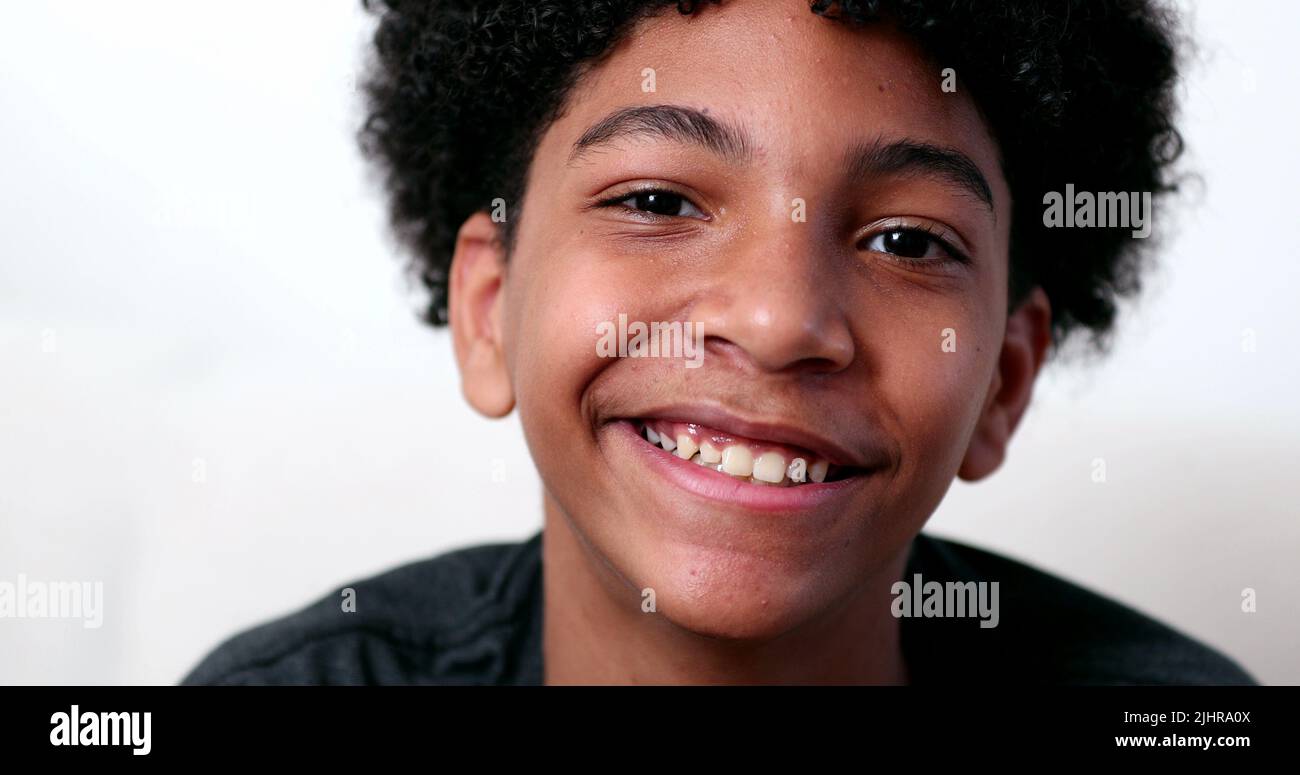 Mixed race young boy smiling at camera portrait. Ethnically diverse ...