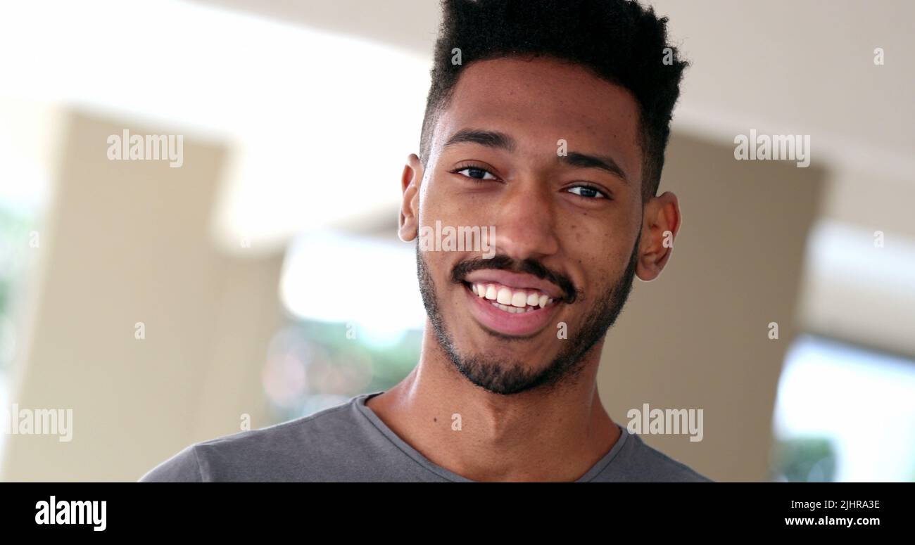 Mixed race young man, black ethnicity person smiling portrait face ...