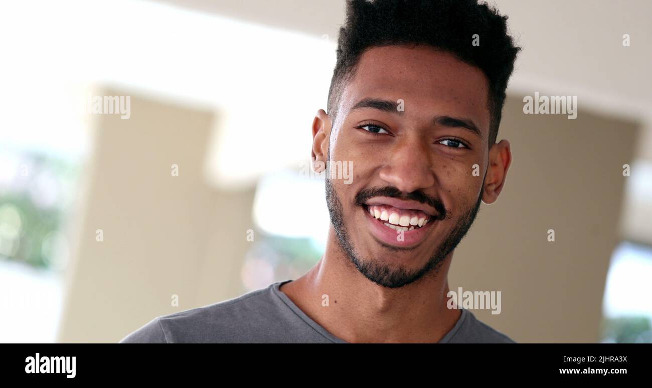 Mixed race young man, black ethnicity person smiling portrait face ...