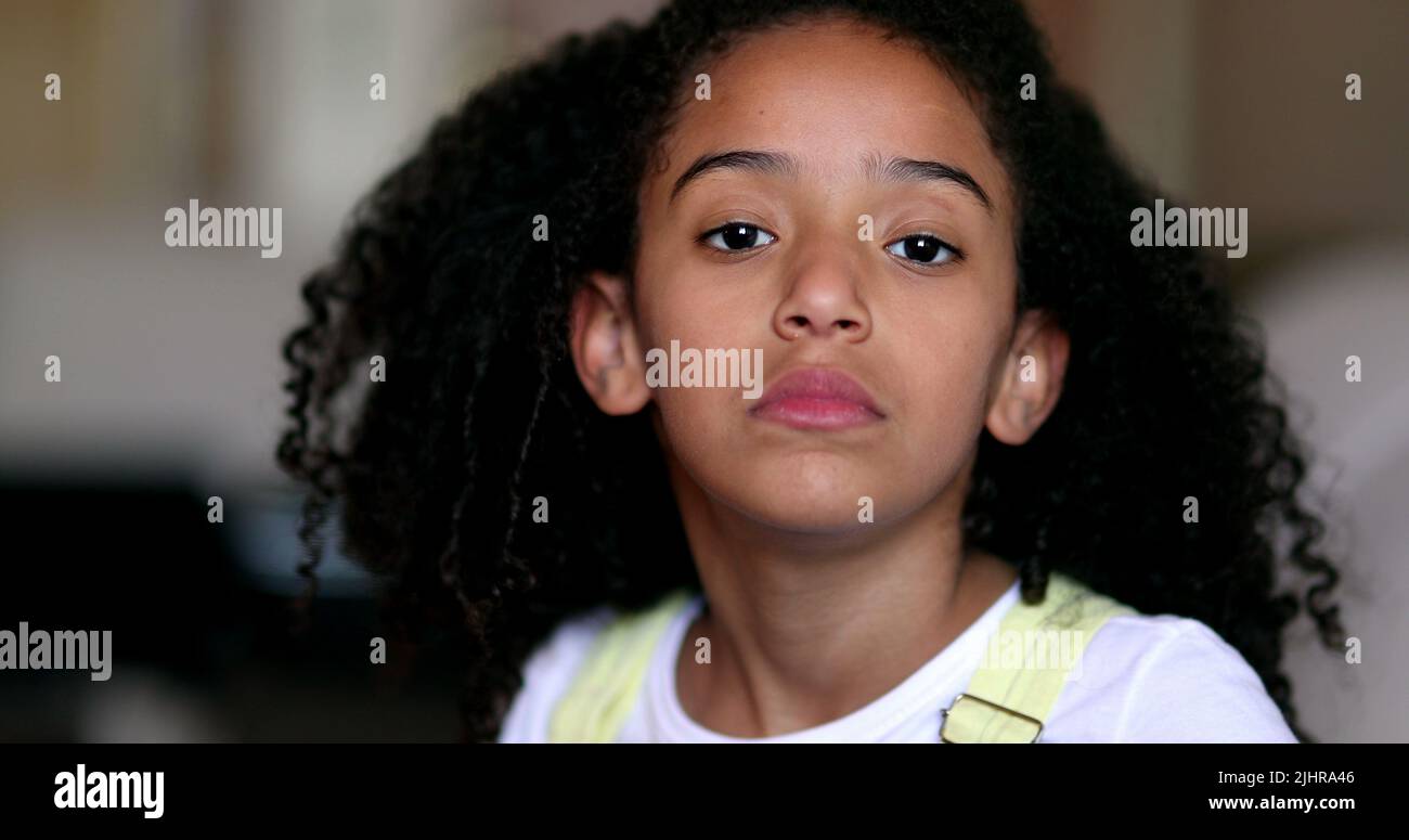 Moody little girl changing emotion, close-up face Stock Photo - Alamy