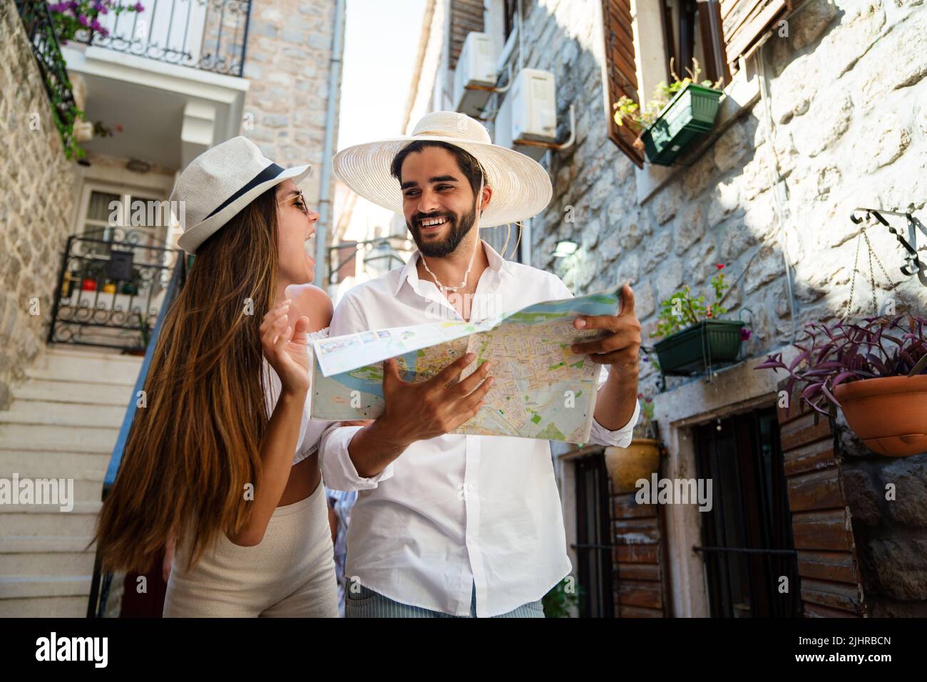 Happy group of friends tourists sightseeing in city on vacation Stock ...
