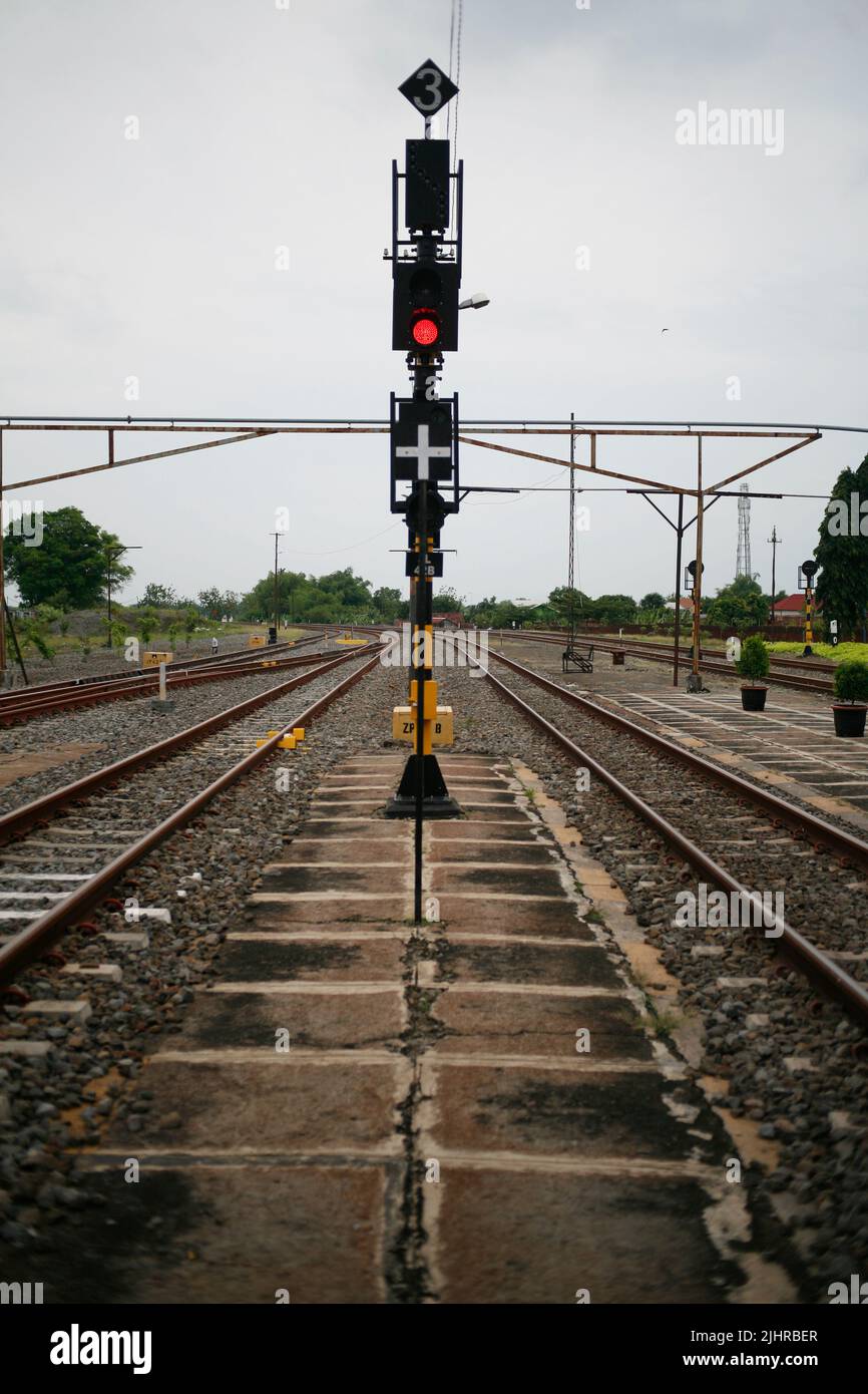 Traffic signs and lights on a railway station in Java, Indonesia Stock ...