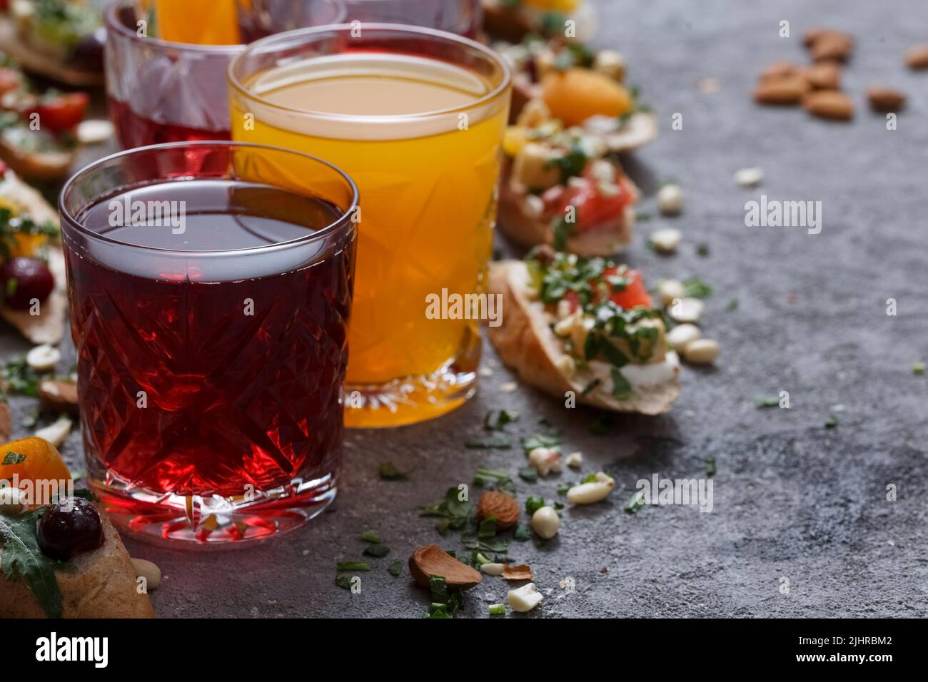 Summer drinks and toasts with fruits on a gray table. Healthy food ...
