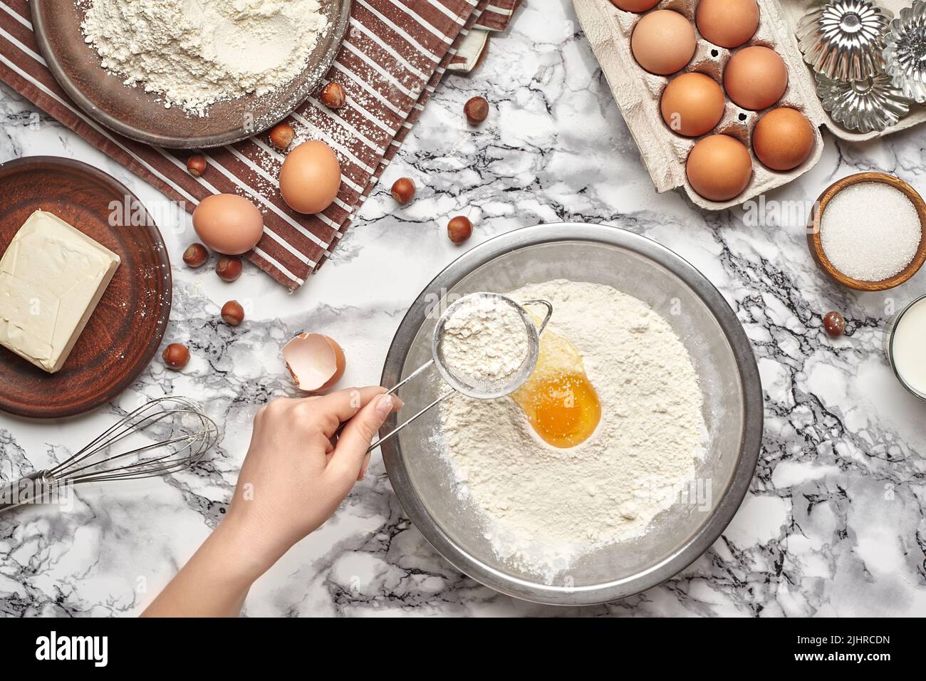 Close-up shot. Top view of a baker cook place, hands are working with a ...