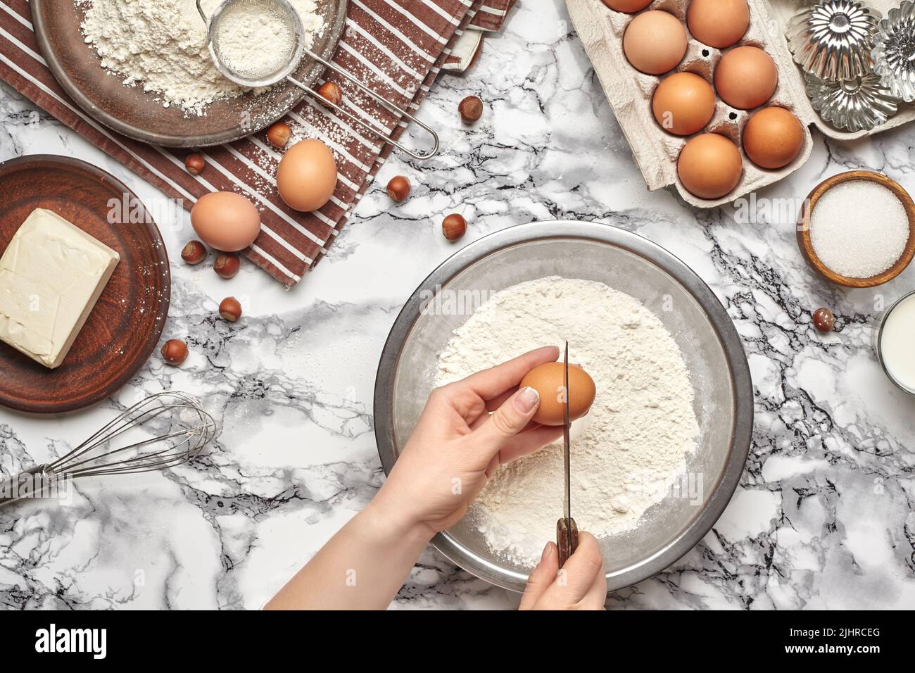 Close-up shot. Top view of a baker cook place, hands are working with a ...