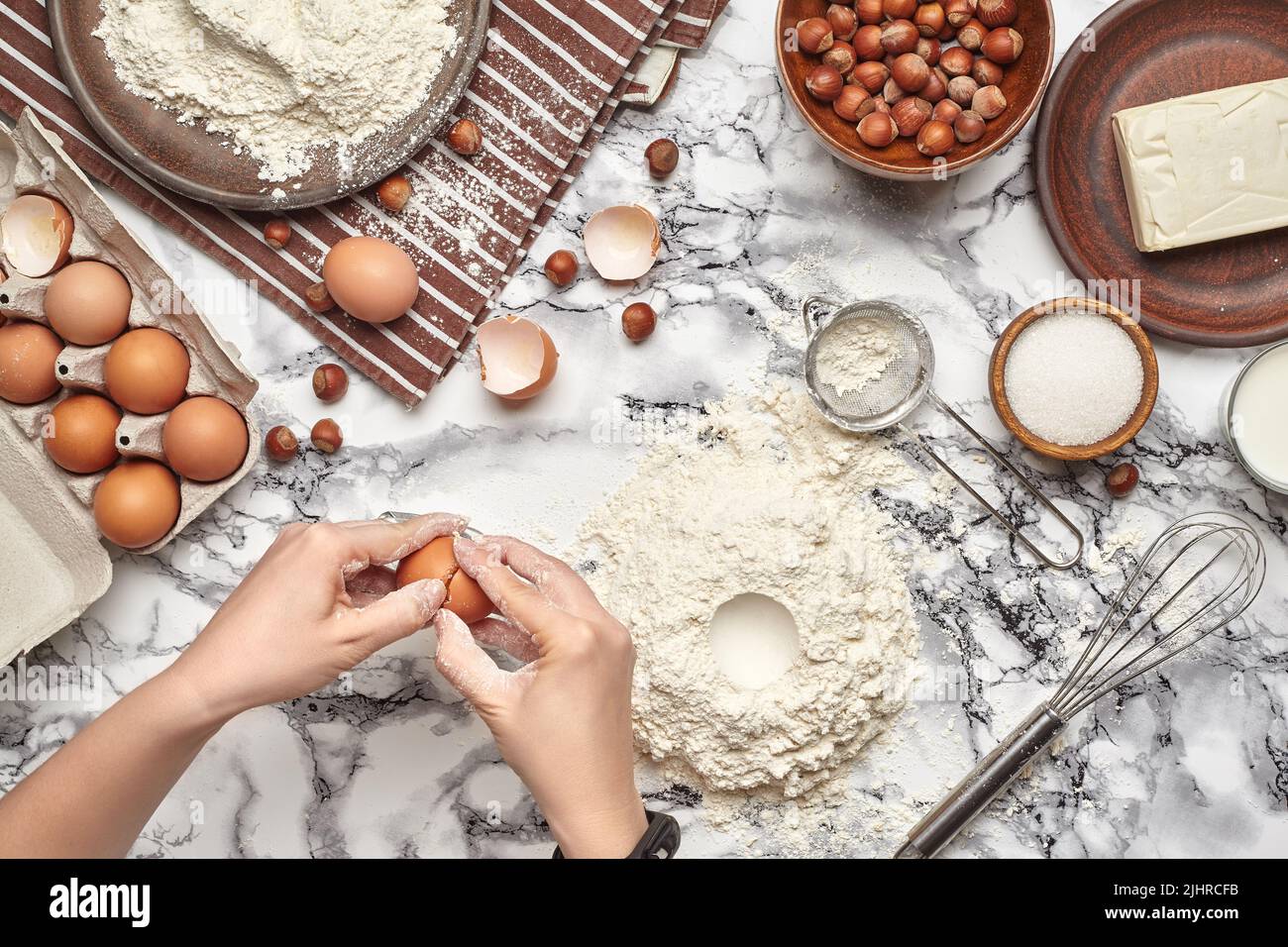 Close-up shot. Top view of a baker cook place, hands are working with a ...