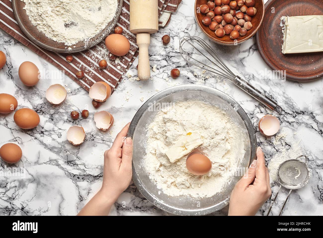 Close-up shot. Top view of a baker cook place, hands are working with a ...