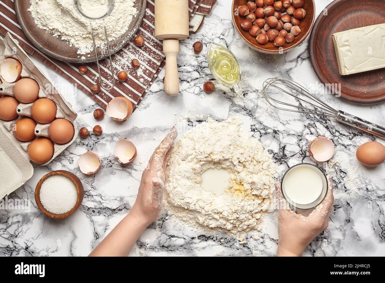 Close-up shot. Top view of a baker cook place, hands are working with a ...
