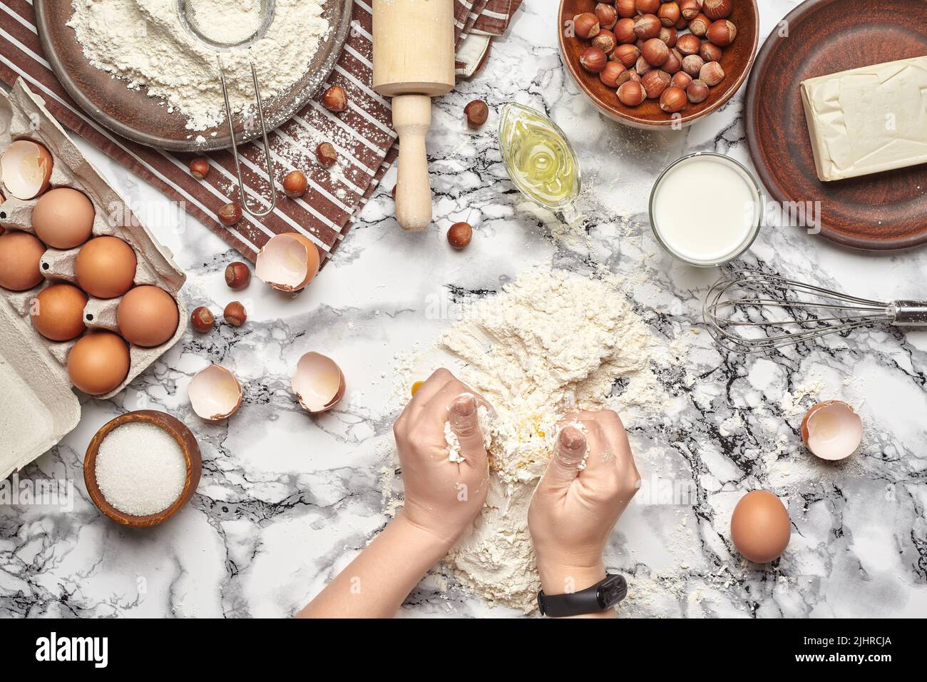 Close-up shot. Top view of a baker cook place, hands are working with a ...