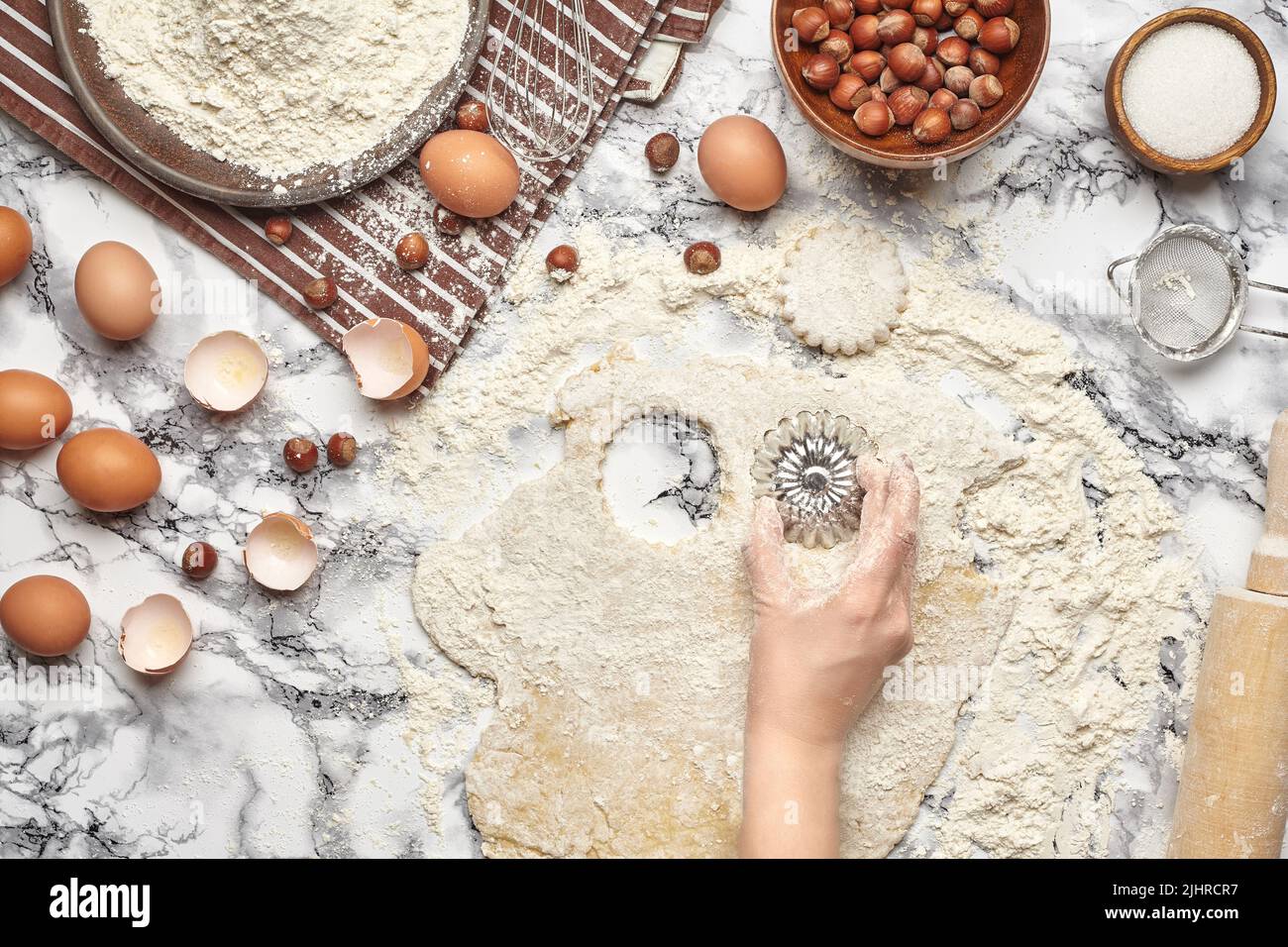 Close-up shot. Top view of a baker cook place, hands are working with a ...
