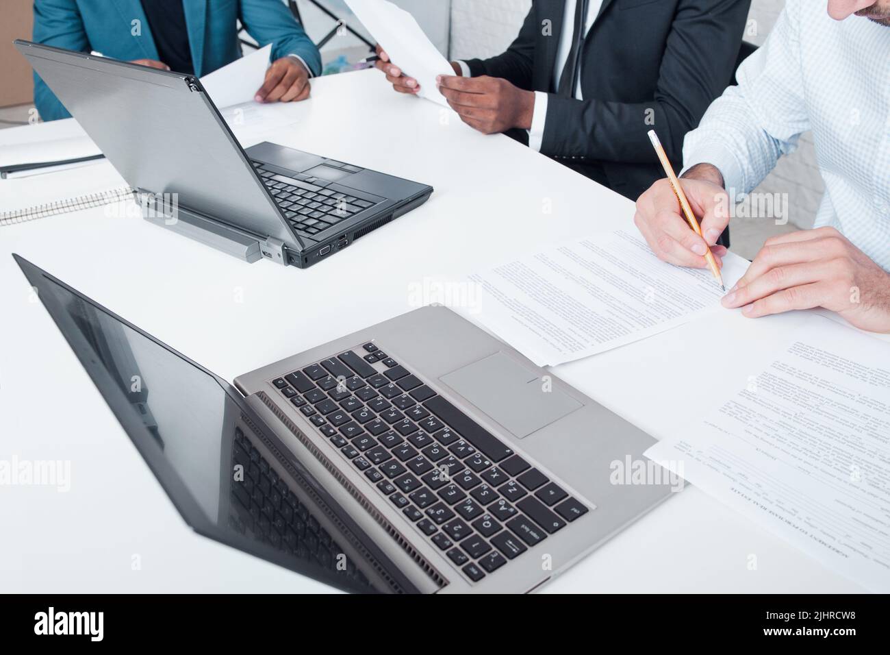 Teamwork. Signing contracts business and finance Stock Photo - Alamy