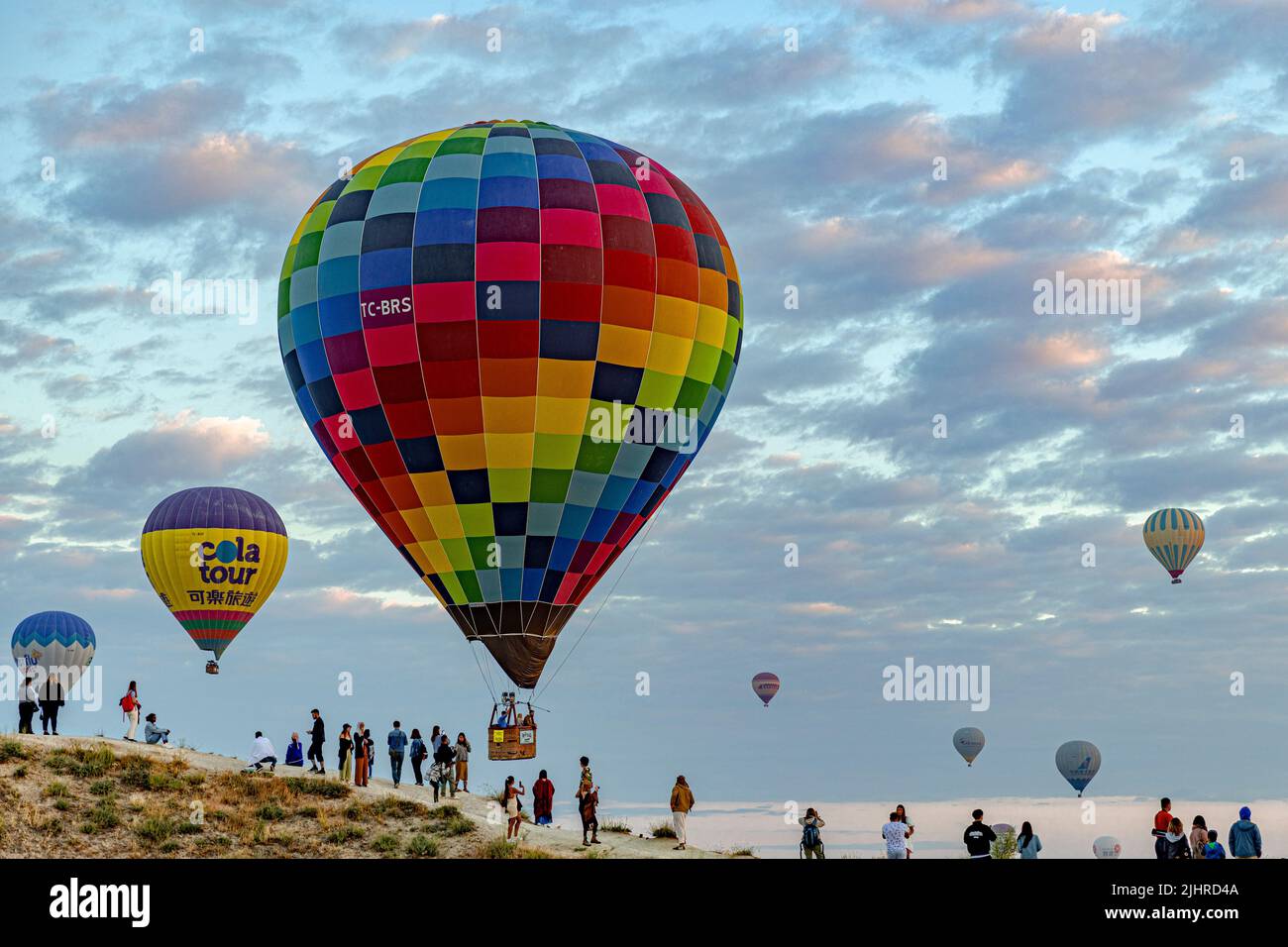 GOREME/TURKEY - June 30, 2022: hot air balloon flies low over the city ...