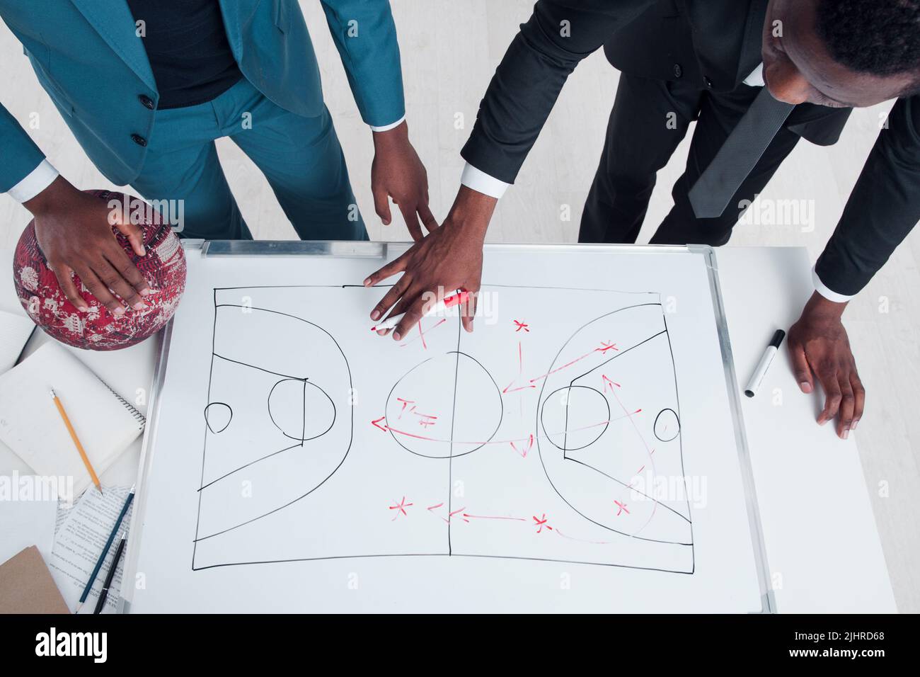 Two basketball coaches plan new game strategy Stock Photo - Alamy
