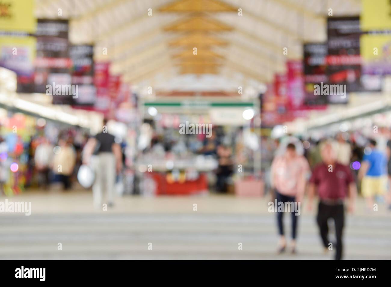 Blurred image of shopping mall and people walking for background usage ...