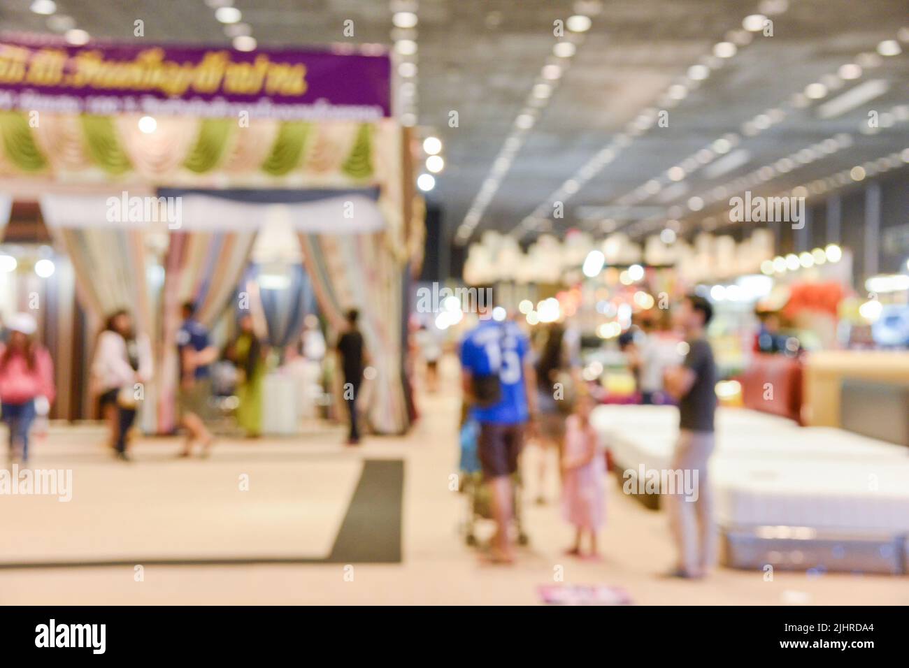 Blurred image of shopping mall and people walking for background usage ...