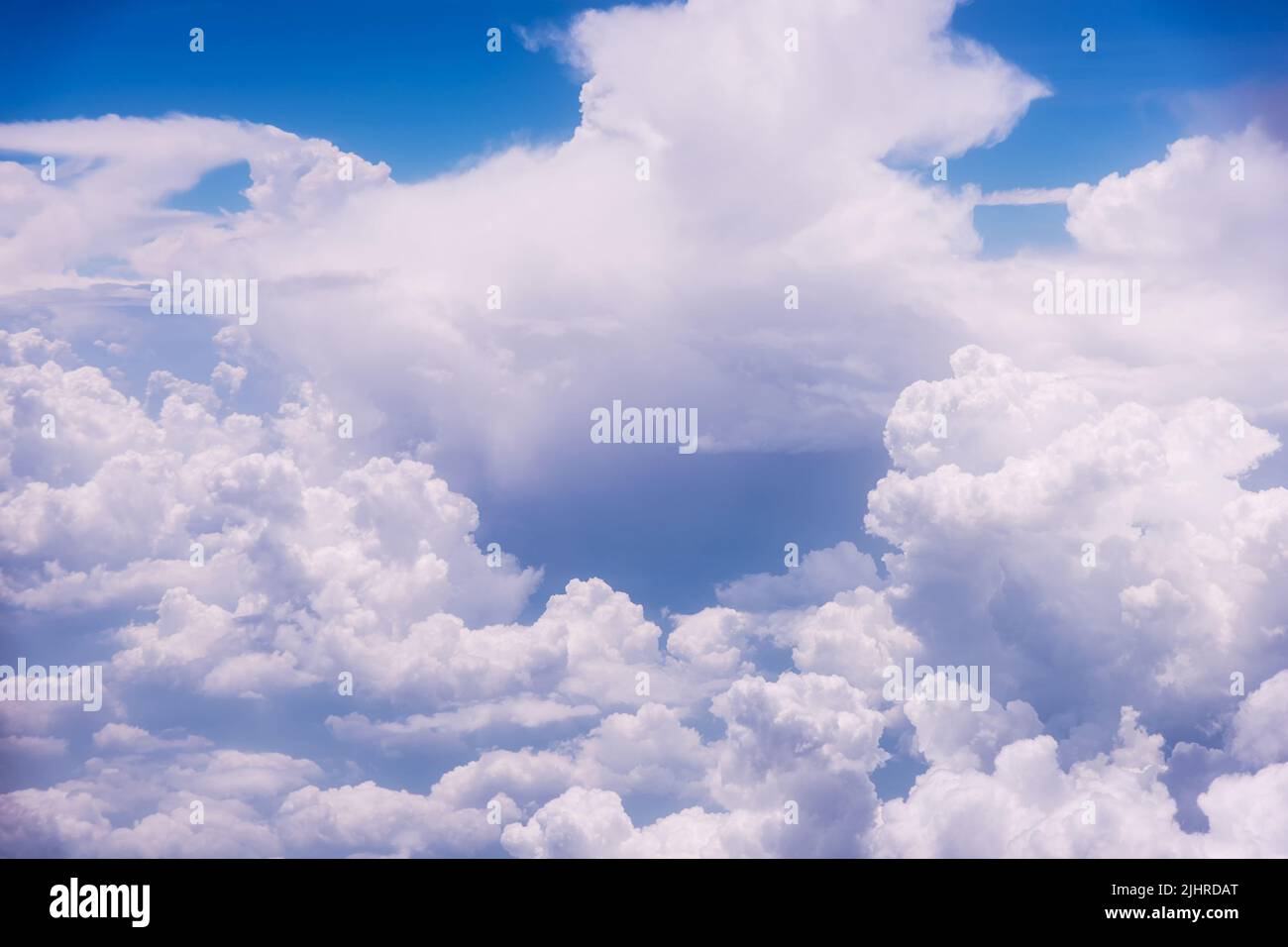 White clouds against blue sky view through an airplane window for a background Stock Photo - Alamy