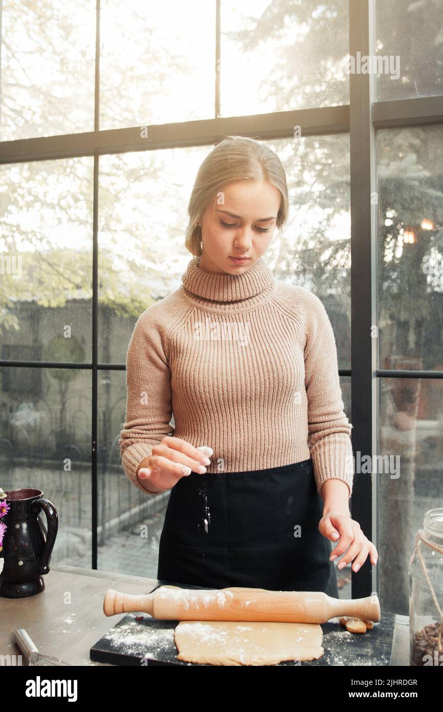Woman making traditional cookies hi-res stock photography and images ...