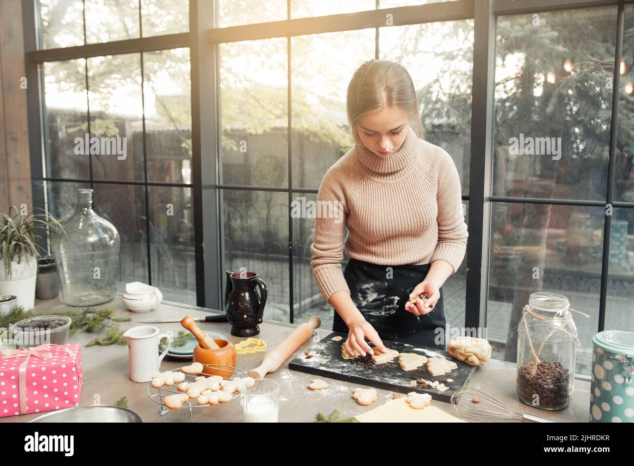Woman decorating delicious cake icing hi-res stock photography and ...