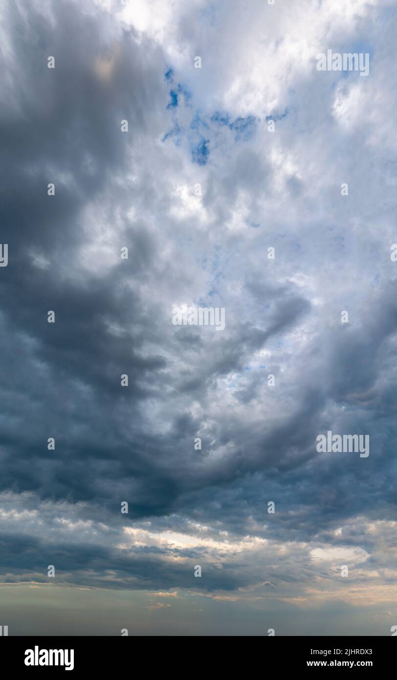 Fantastic thunderclouds at sunrise, vertical panorama Stock Photo - Alamy