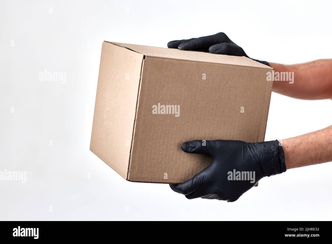 Box closed delivery hand hi-res stock photography and images - Alamy