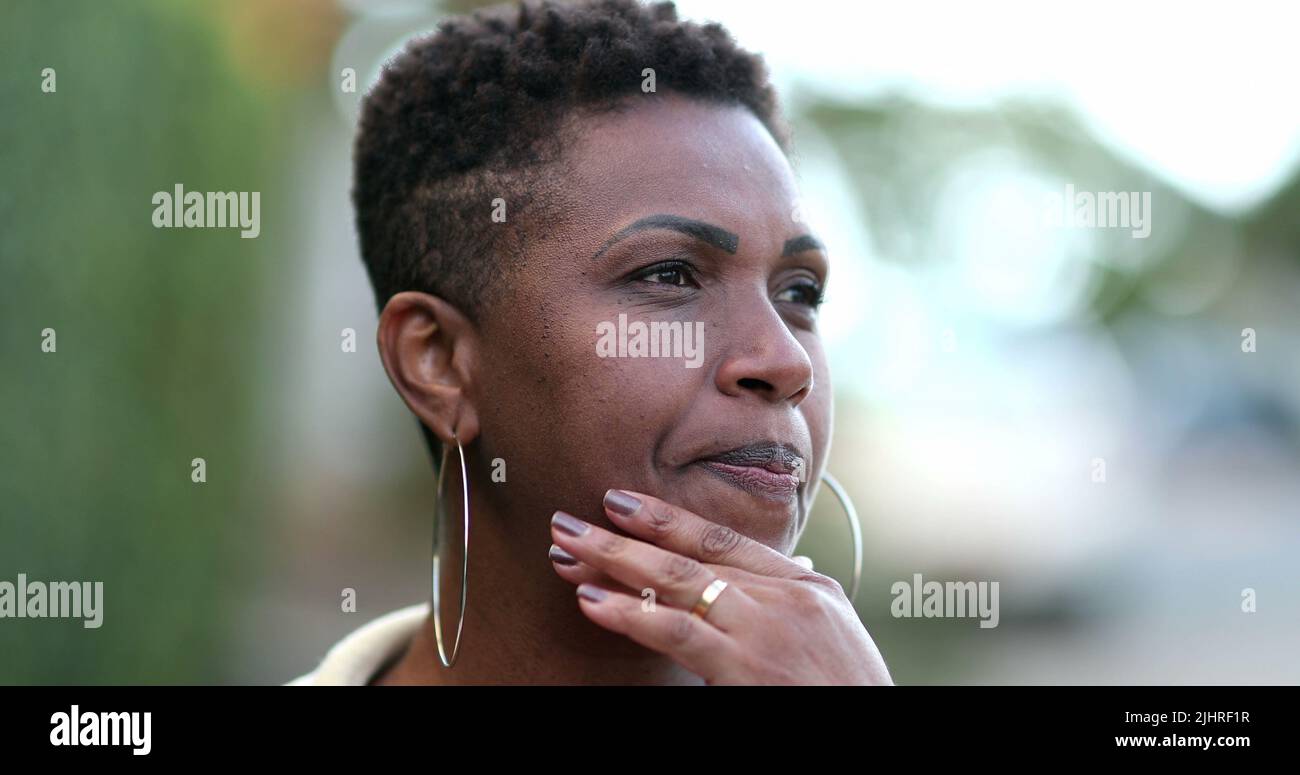 Pensive African woman thinking. Contemplative black lady in deep think ...