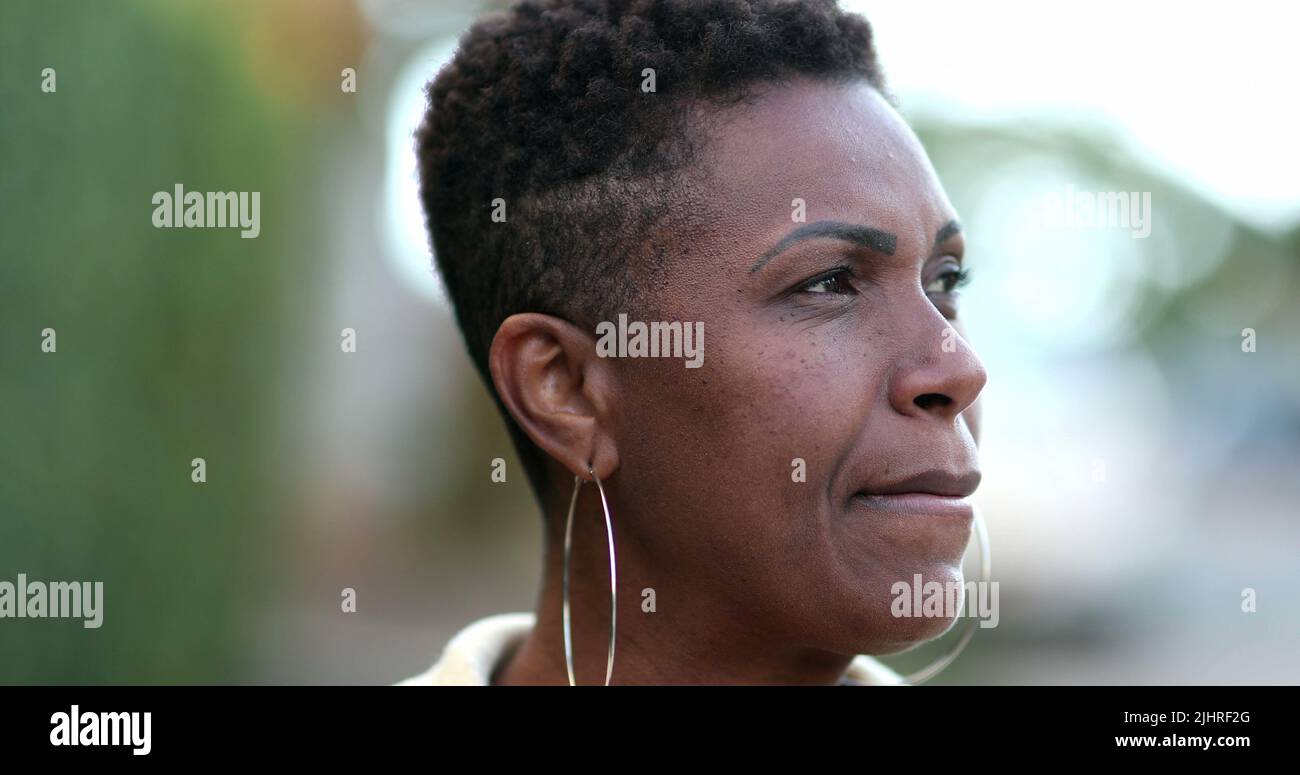 Pensive African woman thinking. Contemplative black lady in deep think ...
