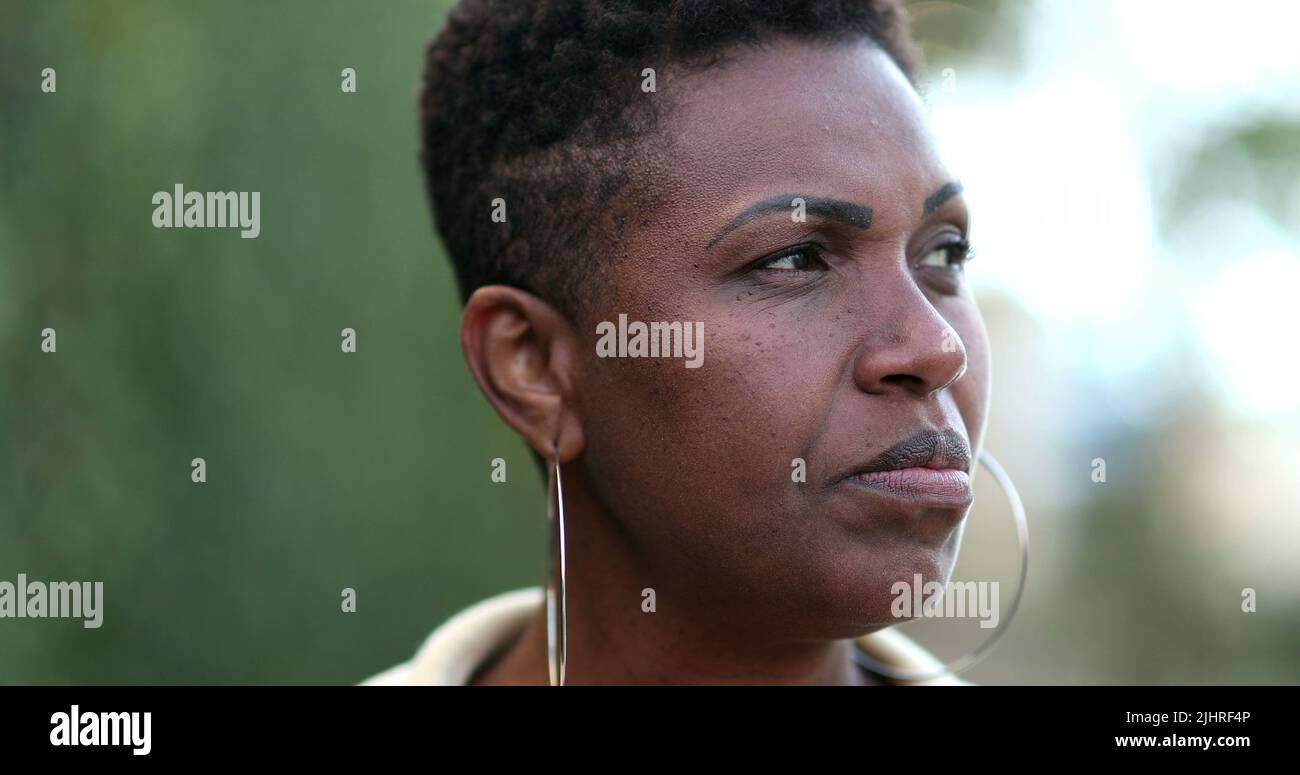 Pensive African woman thinking. Contemplative black lady in deep think ...