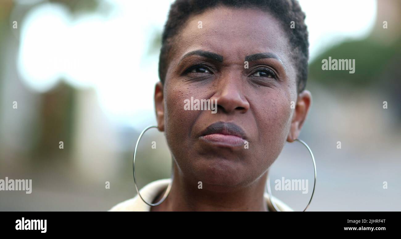 Pensive African woman thinking. Contemplative black lady in deep think ...