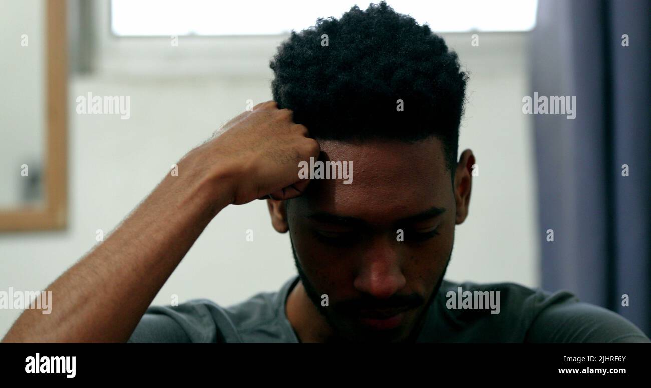 Pensive black man in trouble. African young person in difficult times ...