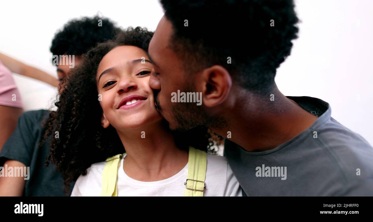 Siblings love care and affection. Older brother kissing little sister ...