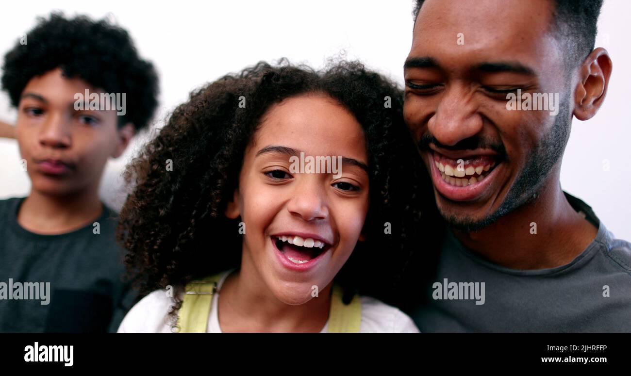 Siblings love care and affection. Older brother kissing little sister ...