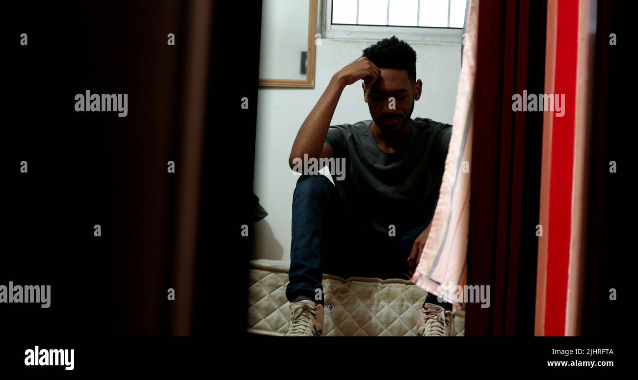 Troubled Black man feeling unhappy and lonely. Desperate frustrated ...