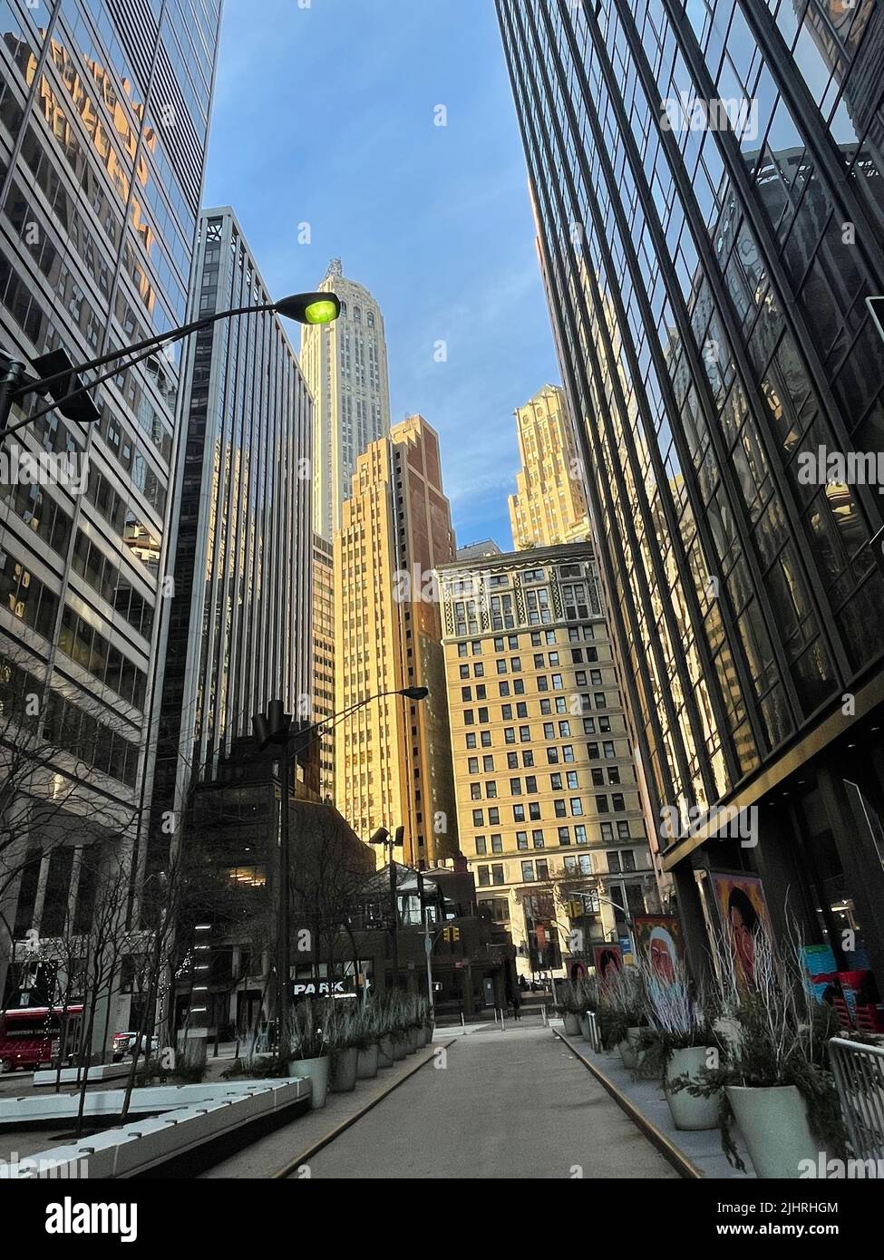 A vertical shot of a walkway with high-rise buildings in New York ...