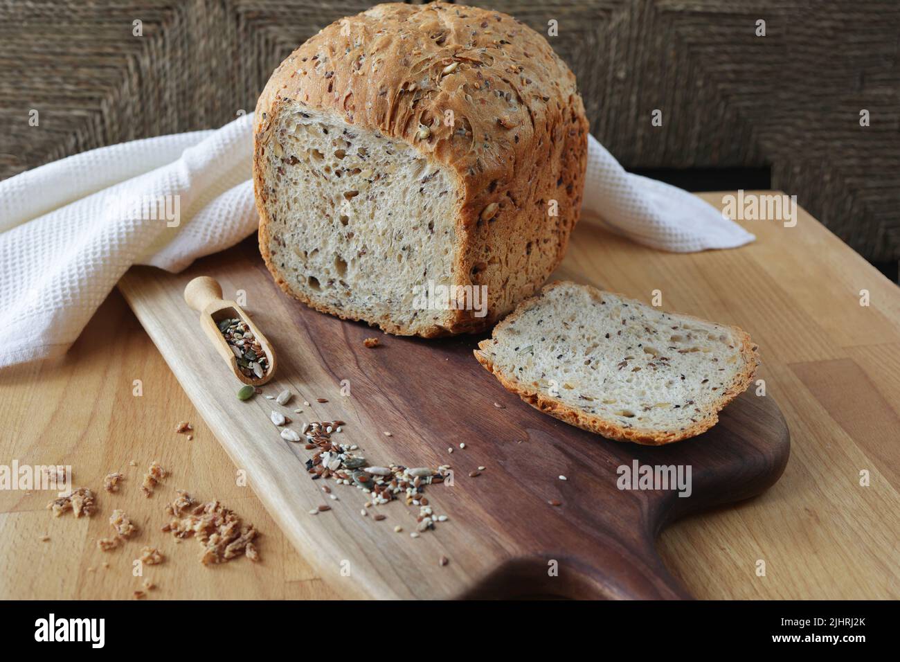 Sliced rye bread on cutting board. Whole grain rye bread with seeds ...
