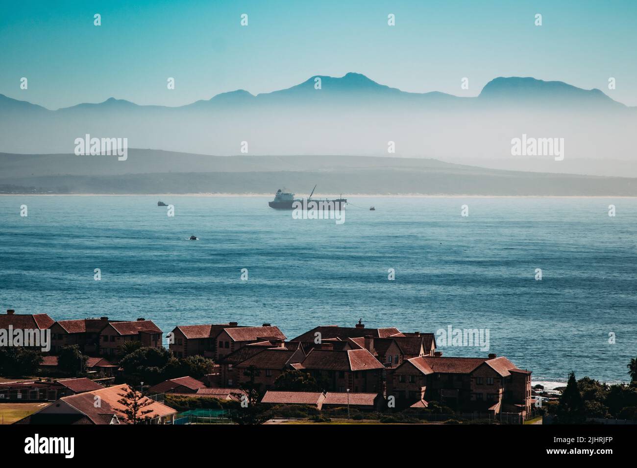 The Mossel Bay area view with a tranquil water and mist covered ...