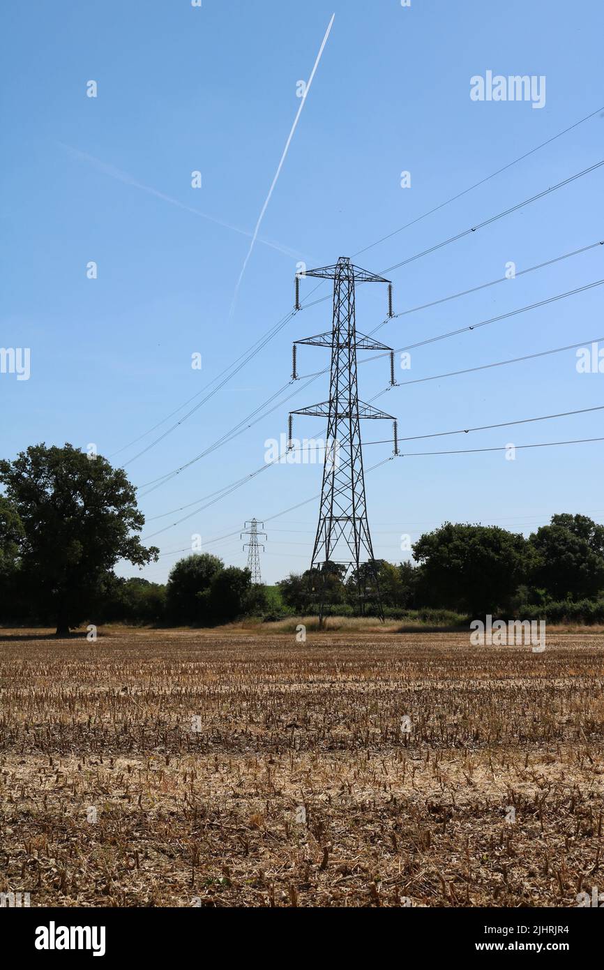 Full frame image of electricity pylon and wires against blue sky Stock ...