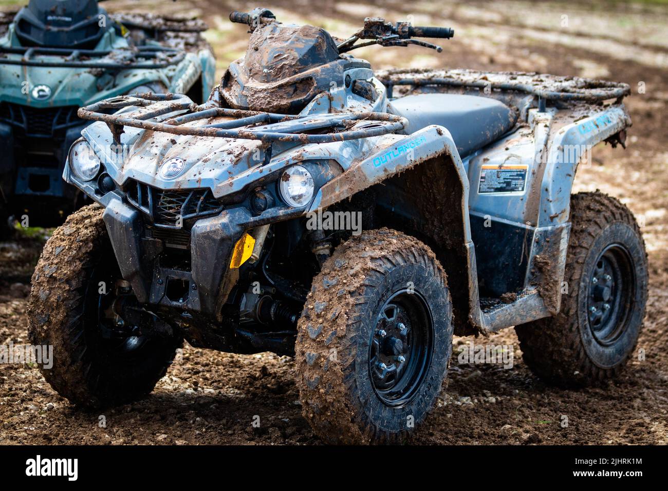 A muddy dirty blue ATV at Rock Fest in 2020 for racing Stock Photo - Alamy